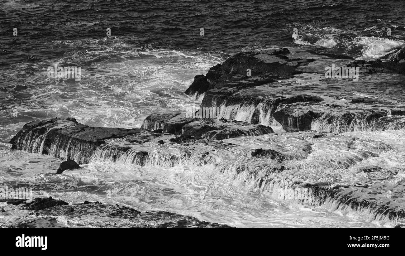 Volcanic sea rocks Black and White Stock Photos & Images - Alamy
