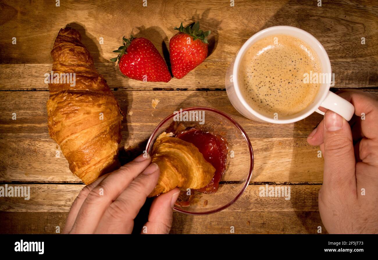 Breakfast table with coffee croissants and jam Stock Photo - Alamy