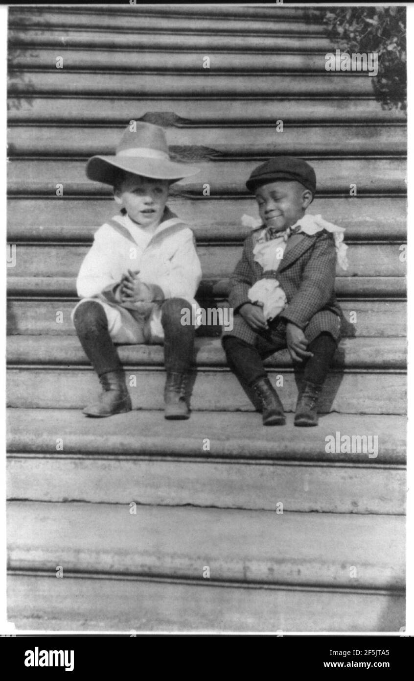 Quentin Roosevelt and Roswell Newcomb Pinckney seated on steps Stock ...