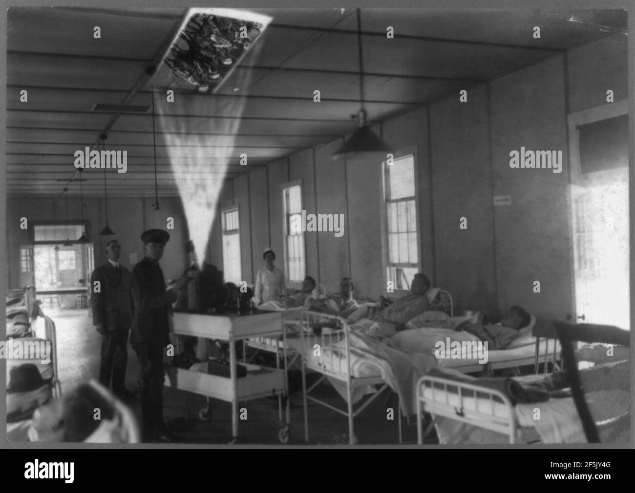 R. Hayes Hamilton shows motion pictures (of cowboys and Indians) on the ...