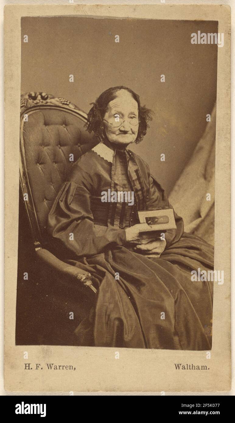 Elderly woman holding a photograph. Henry F. Warren (American, active ...
