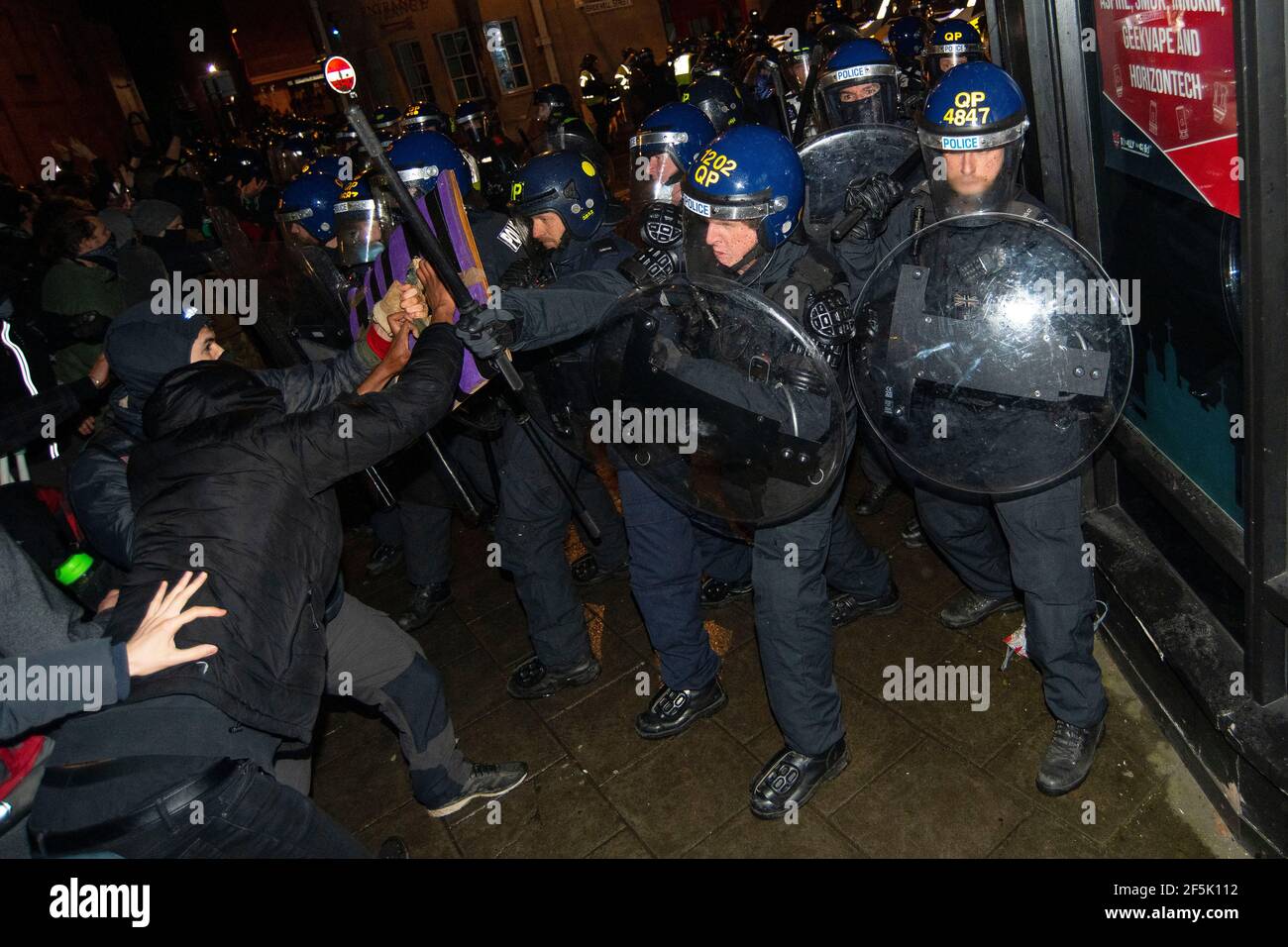Riot police and protesters clash as officers begin to disperse the ...