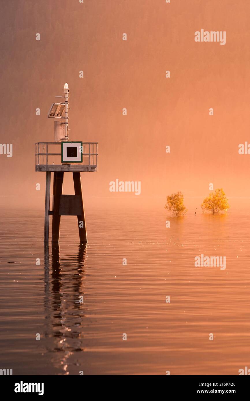 A marker to boats to indicate shallow water in the early morning ...