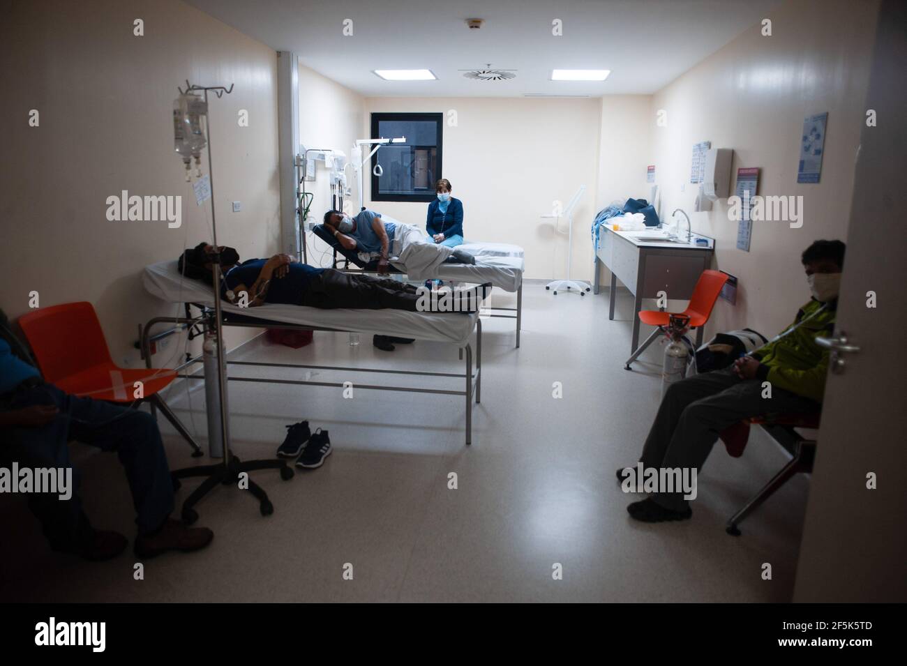 Several COVID19 patients seen on hospital beds in consultation rooms in ...