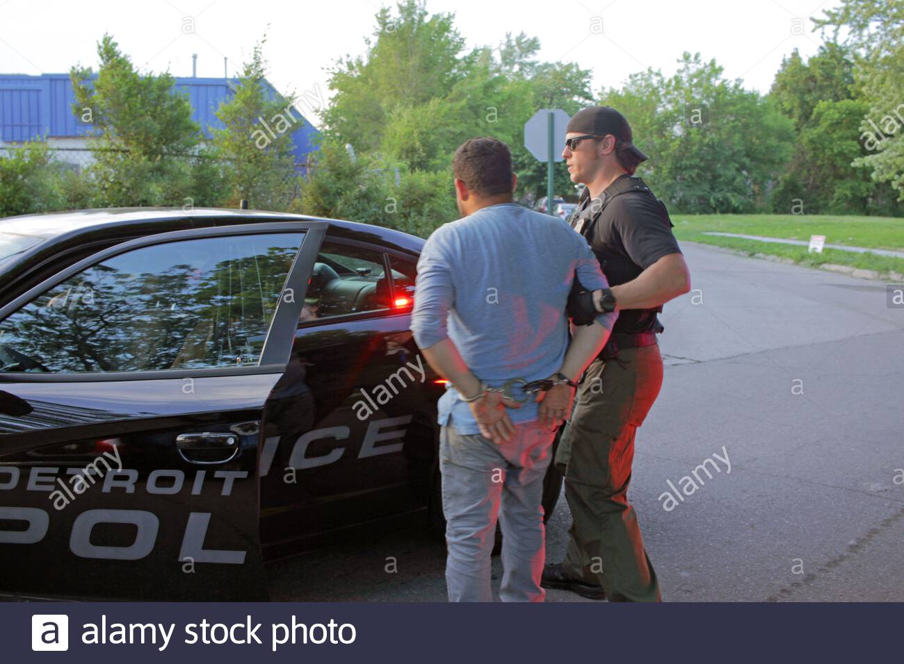 Man Handcuffed Police Car High Resolution Stock Photography and Images ...