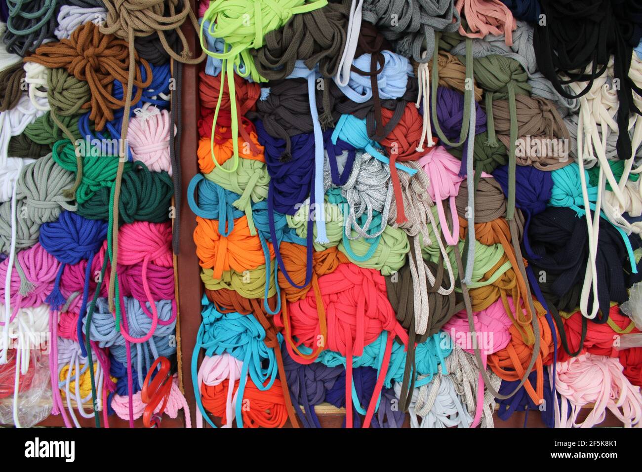 Tying strings hi-res stock photography and images - Alamy