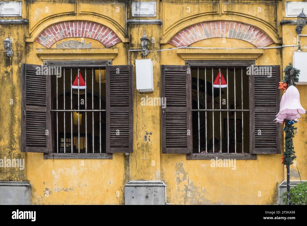 Old building in Vietnam showing barred windows, wooden shutters and ...