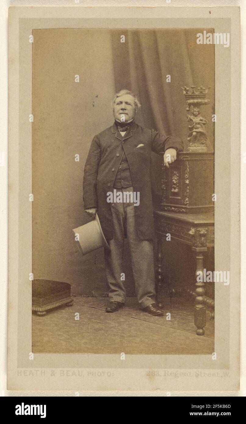 Man standing, holding a top hat. Heath & Beau (British, active 1860s ...