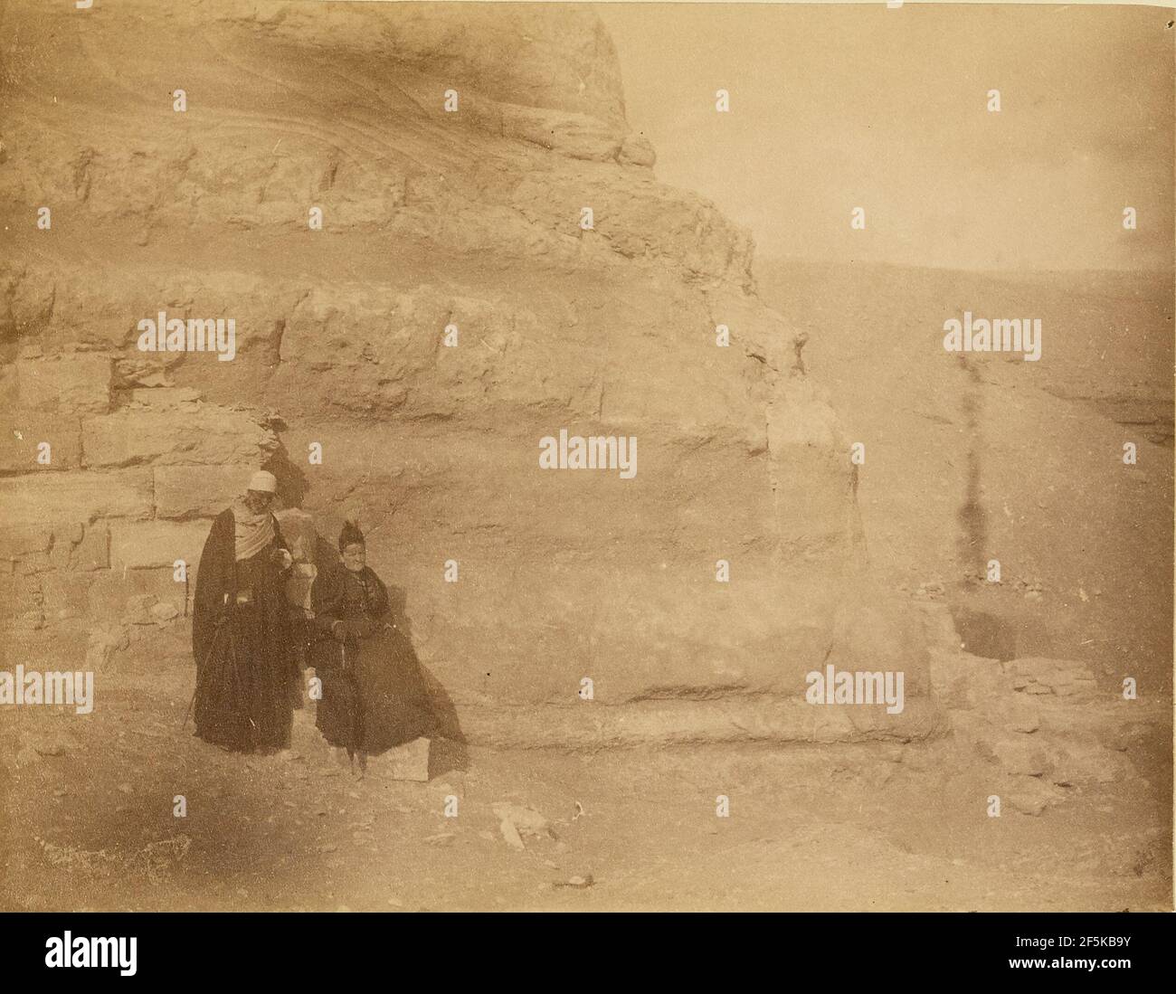 Two men at base of ruins. Unknown Stock Photo - Alamy