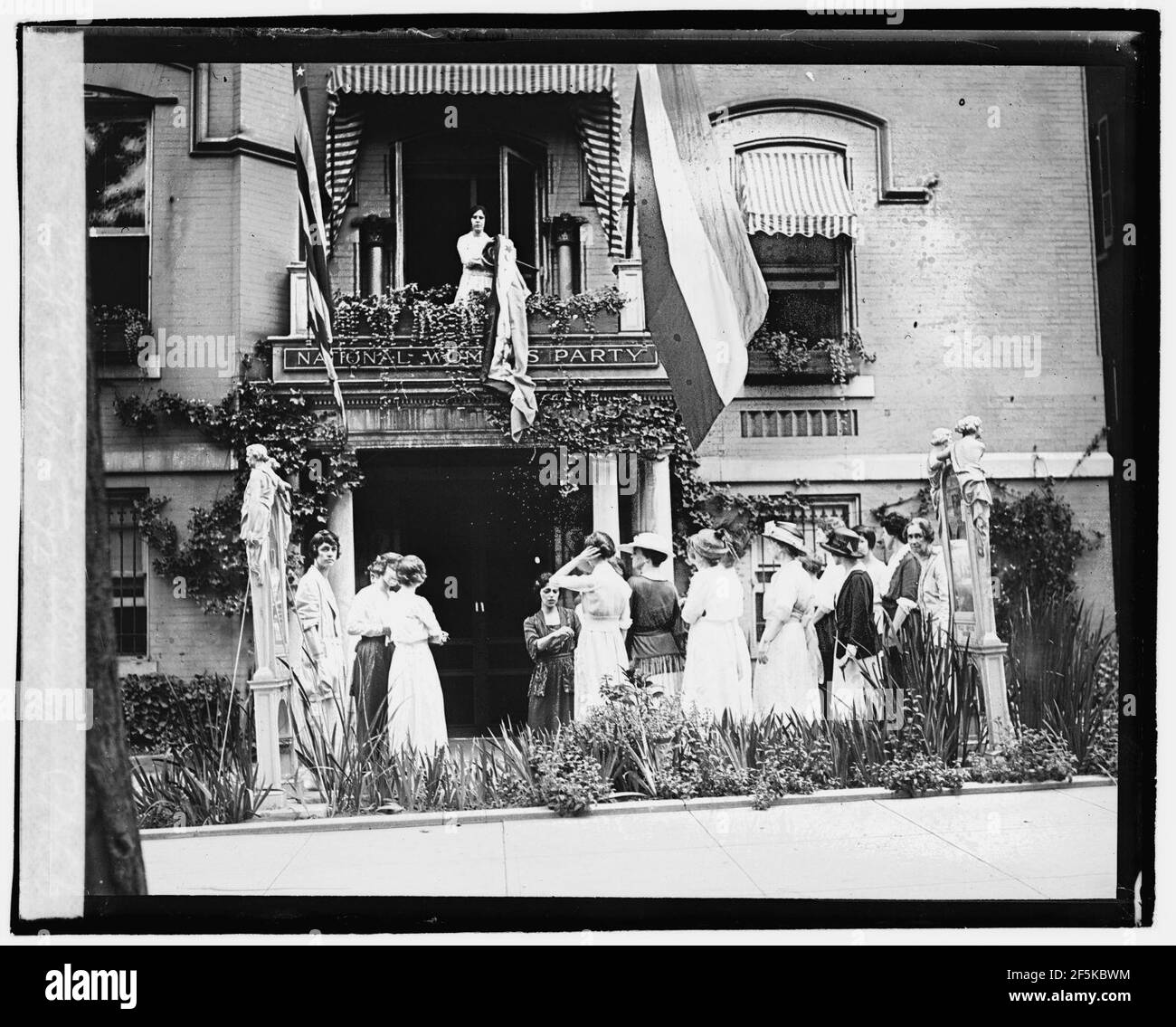 Raising the Suffrage flag when terms ratified Stock Photo - Alamy