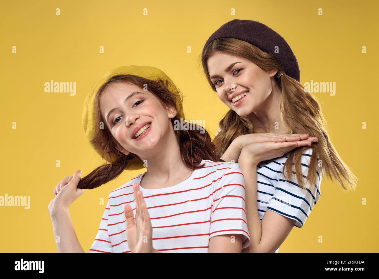 funny mom and daughter wearing hats fashion fun joy family yellow ...