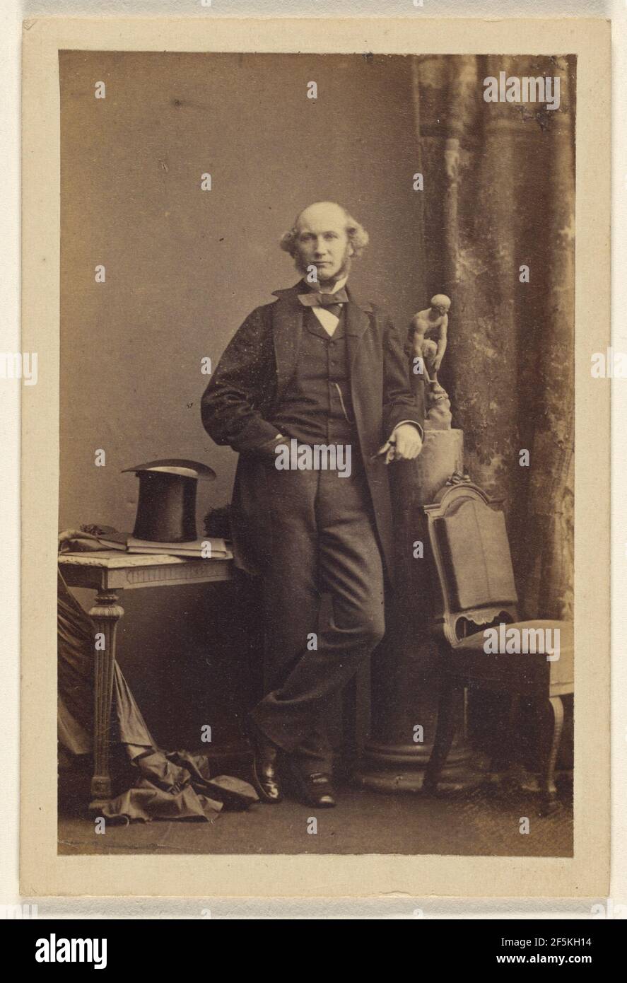 Unidentified man standing, top hat on table. Camille Silvy (French ...