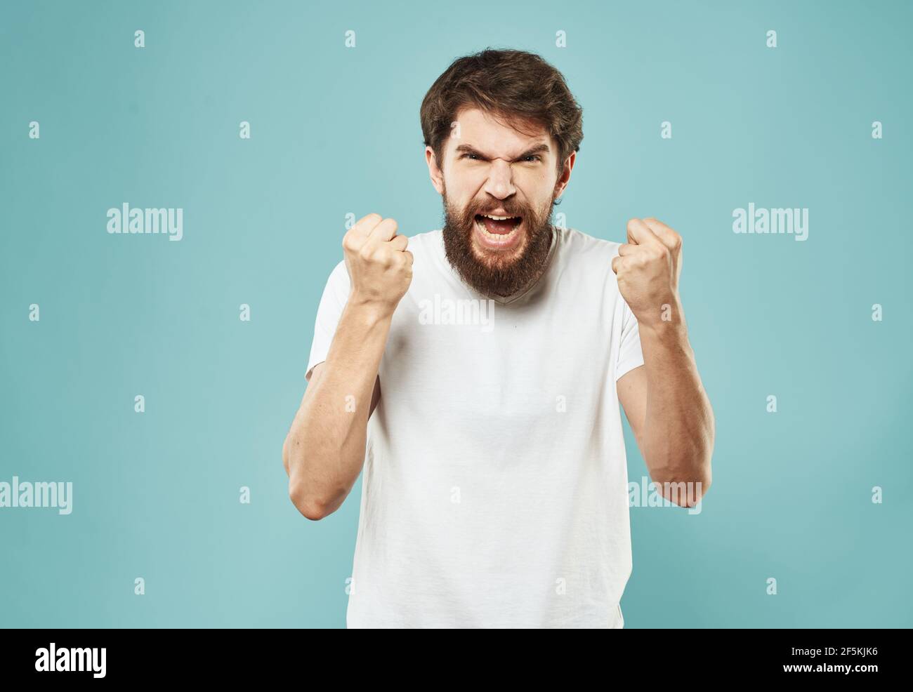 Aggressive man emotions and stress irritability blue background Stock ...