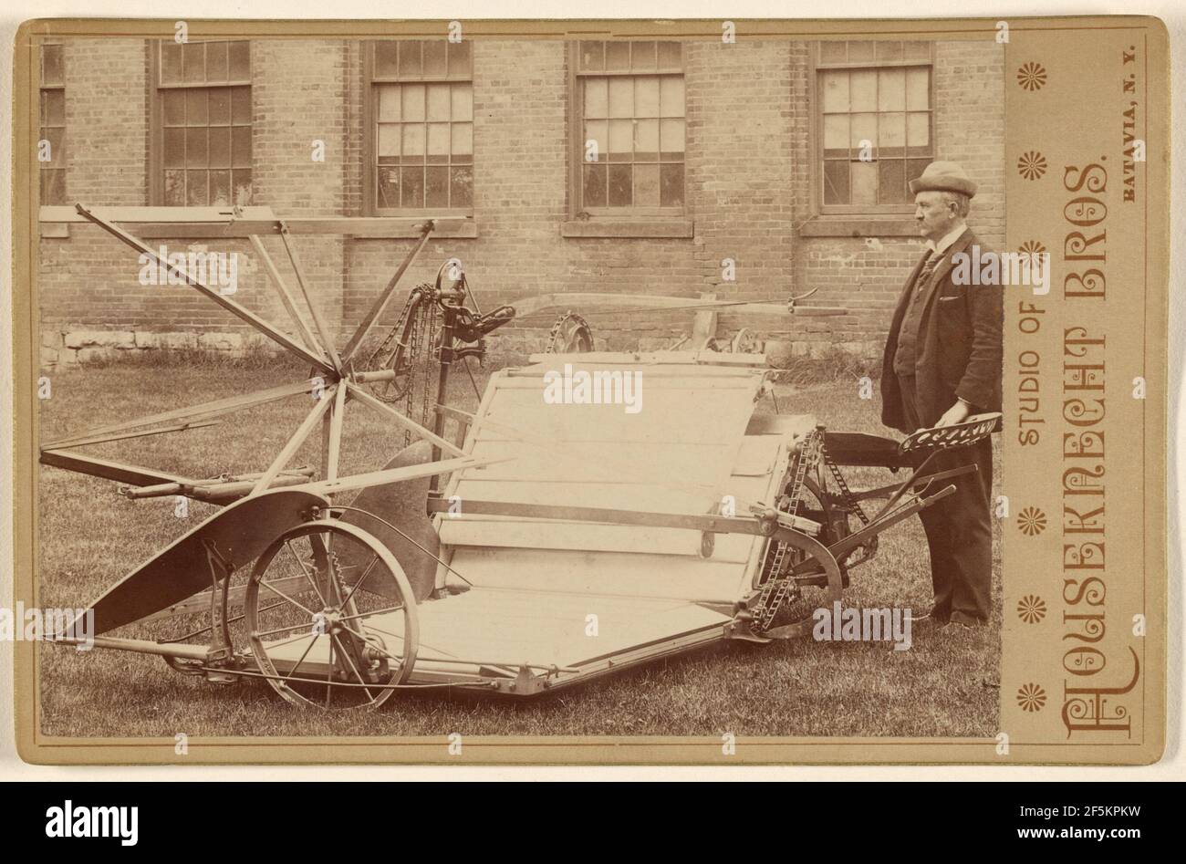 Man posing with a piece of farm machinery. Houseknecht & Brothers Stock ...