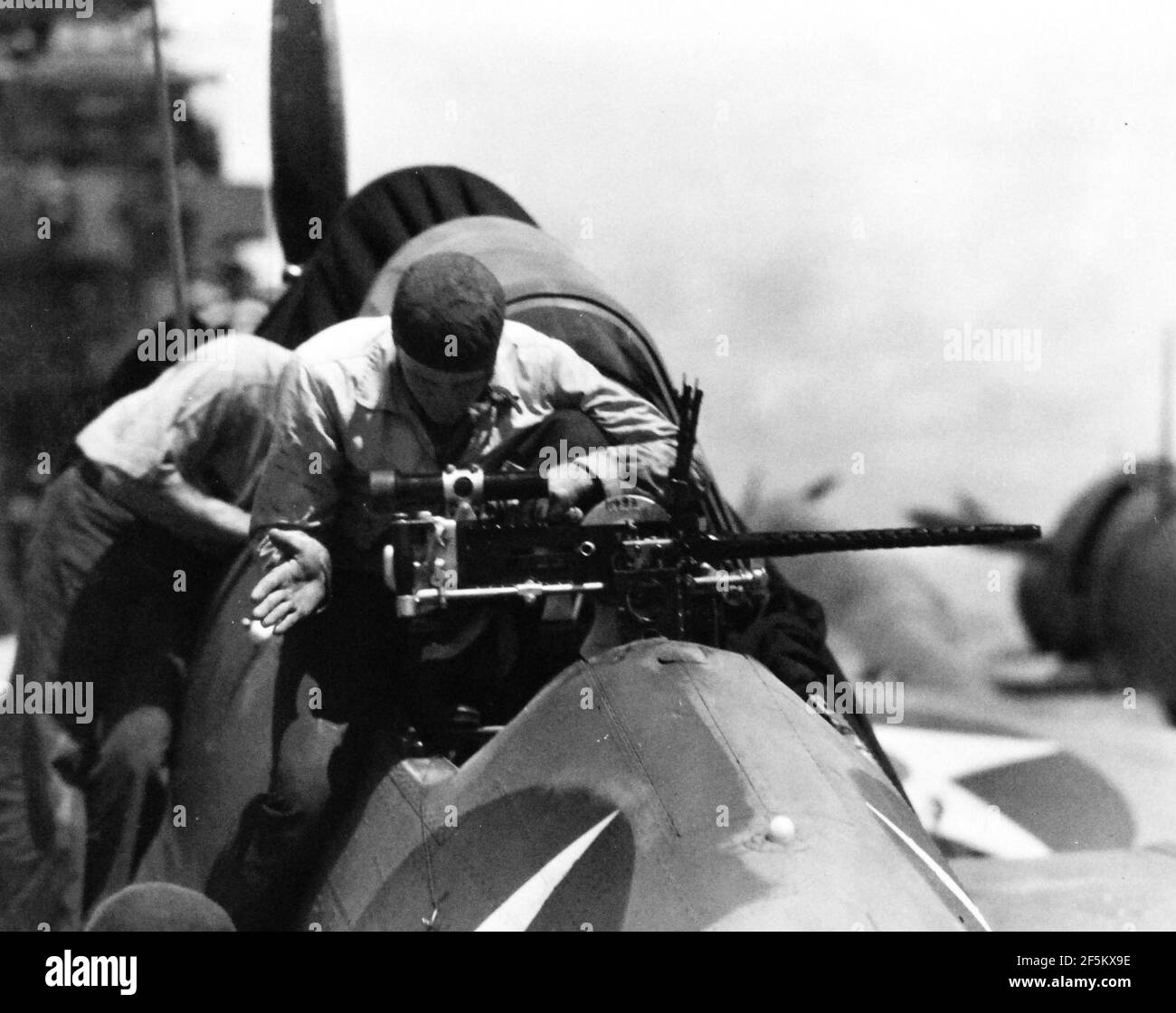 Rear machine gun inspection of a Douglas SBD-3 Dauntless aboard USS ...