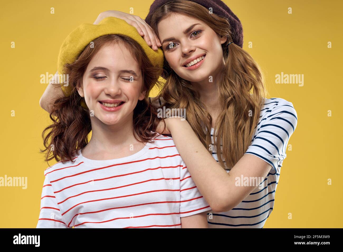 funny mom and daughter fashion clothes studio lifestyle yellow ...