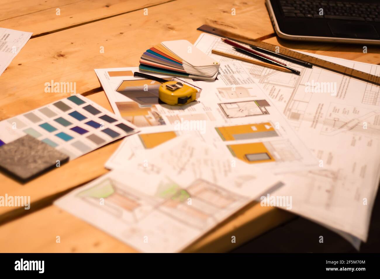 Blueprints and plans of a construction project with architect's tools ...