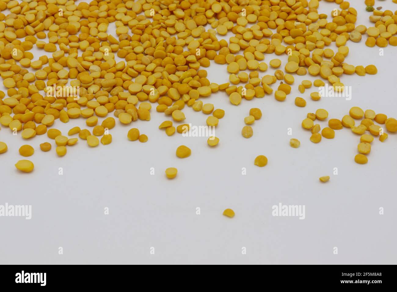 Daal Chana, Heap of yellow split chickpeas isolated on white background ...