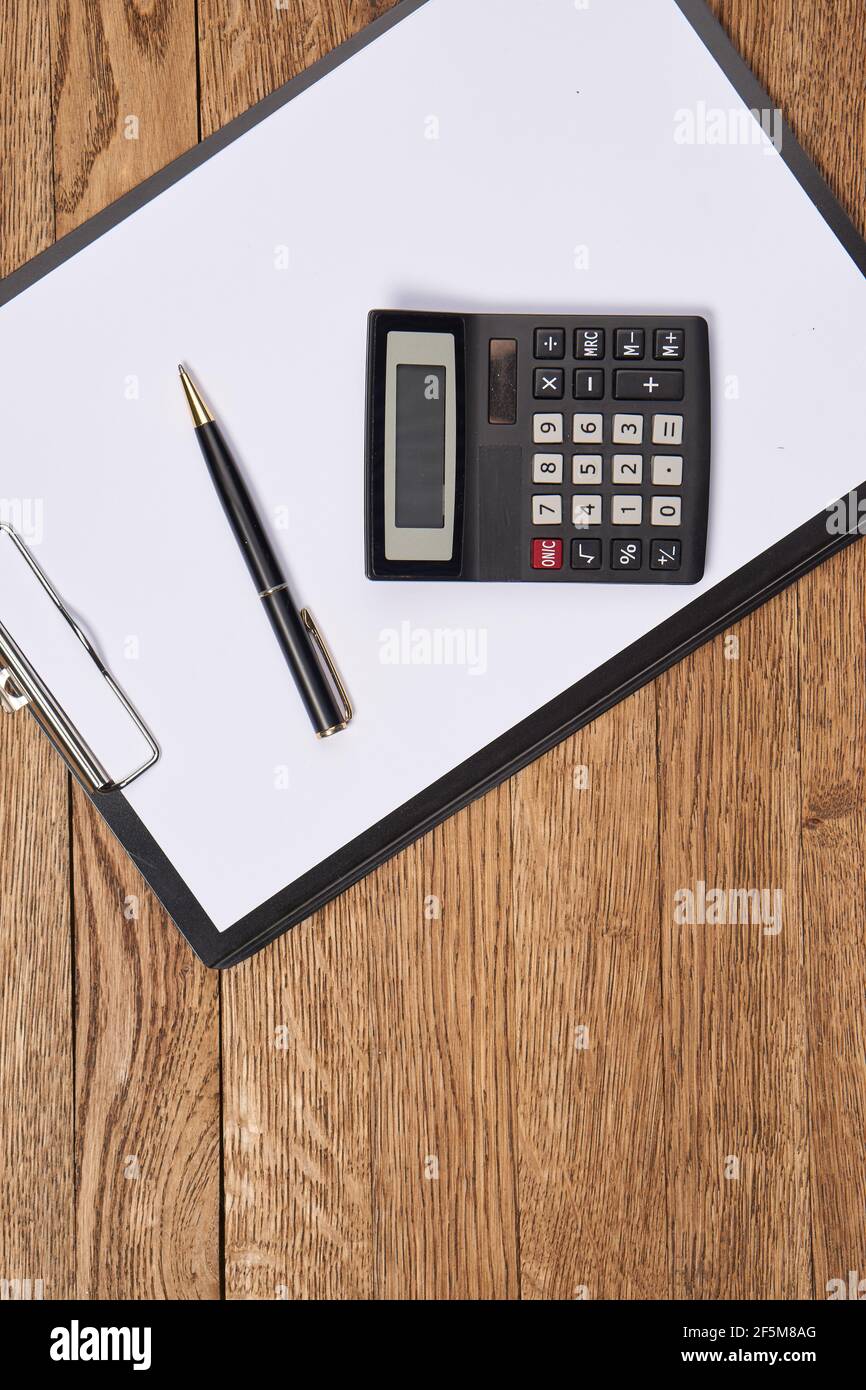 desktop calculator folder for papers top view wooden background Stock ...