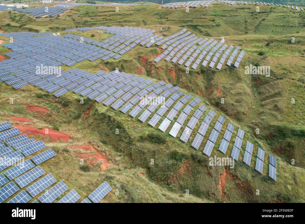 Aerial Photography of a Photovoltaic Power Plant on Lush Hillside Stock ...