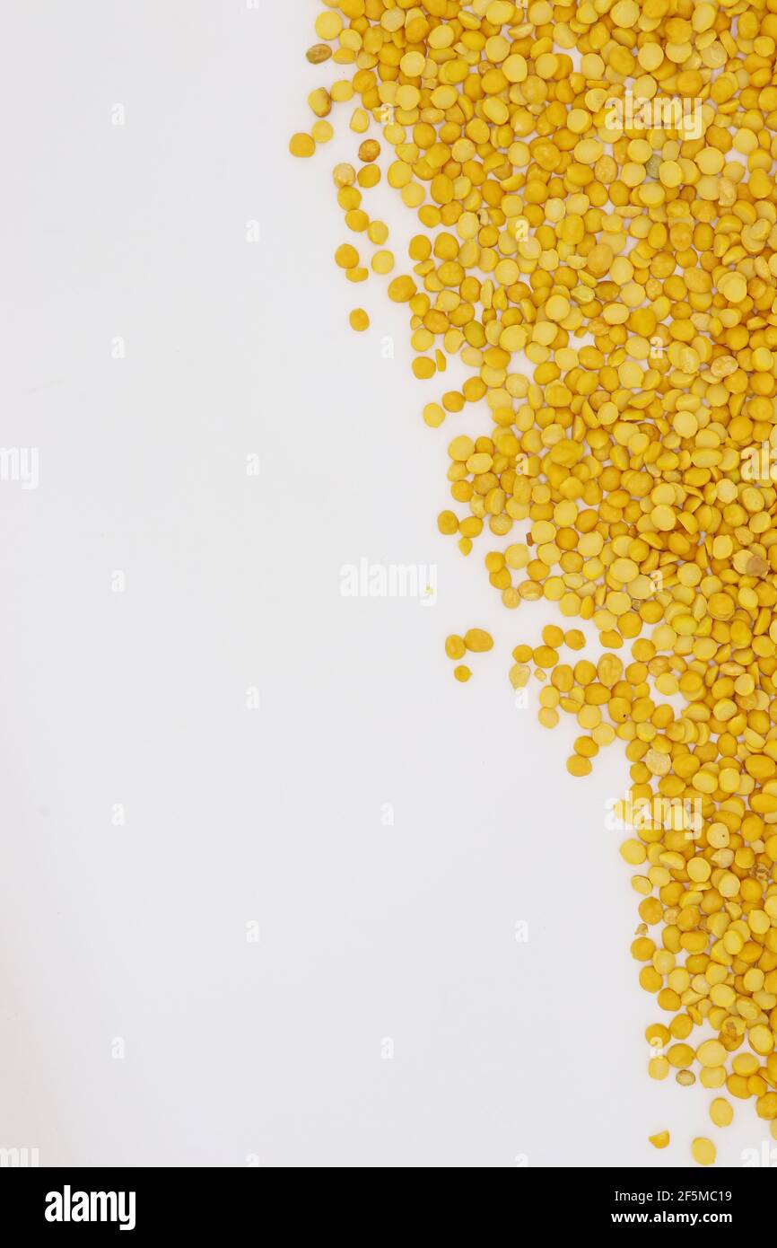 Daal Chana, Heap of yellow split chickpeas isolated on white background ...