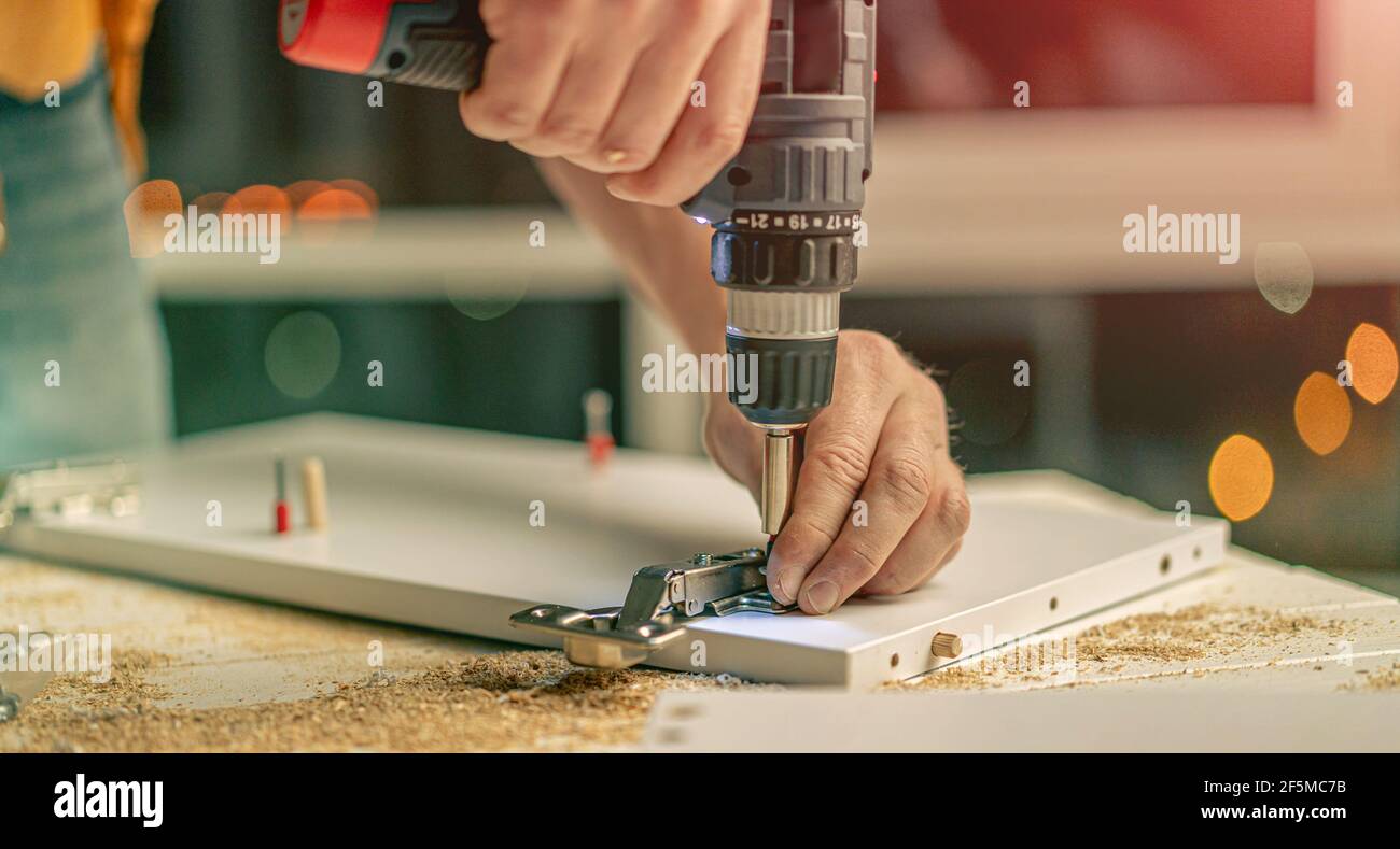 Man working during process of furniture manufacturing Stock Photo - Alamy