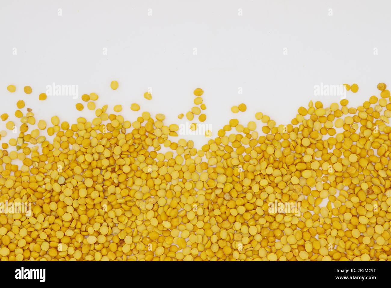 Daal Chana, Heap of yellow split chickpeas isolated on white background ...