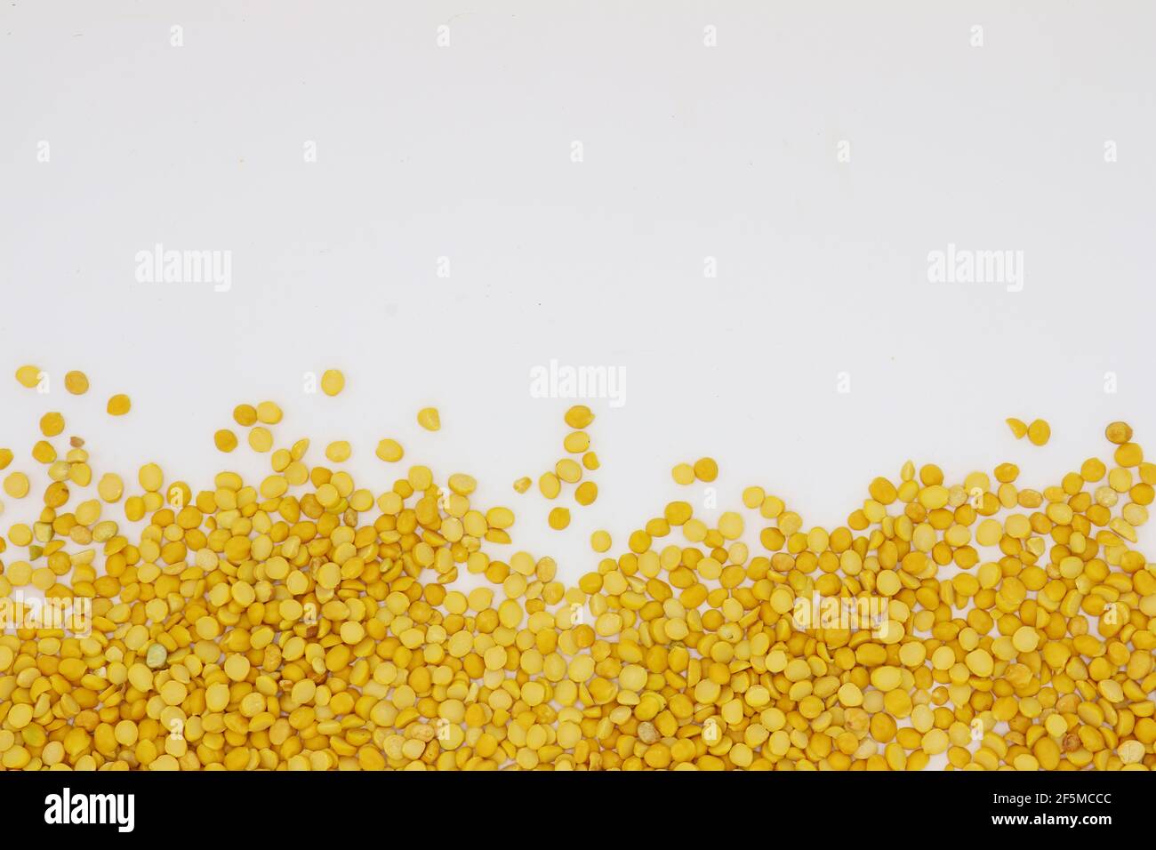 Daal Chana, Heap of yellow split chickpeas isolated on white background ...