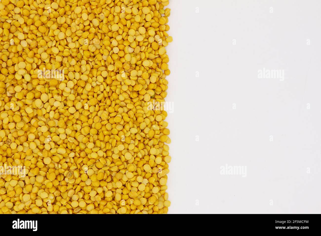 Daal Chana, Heap of yellow split chickpeas isolated on white background ...