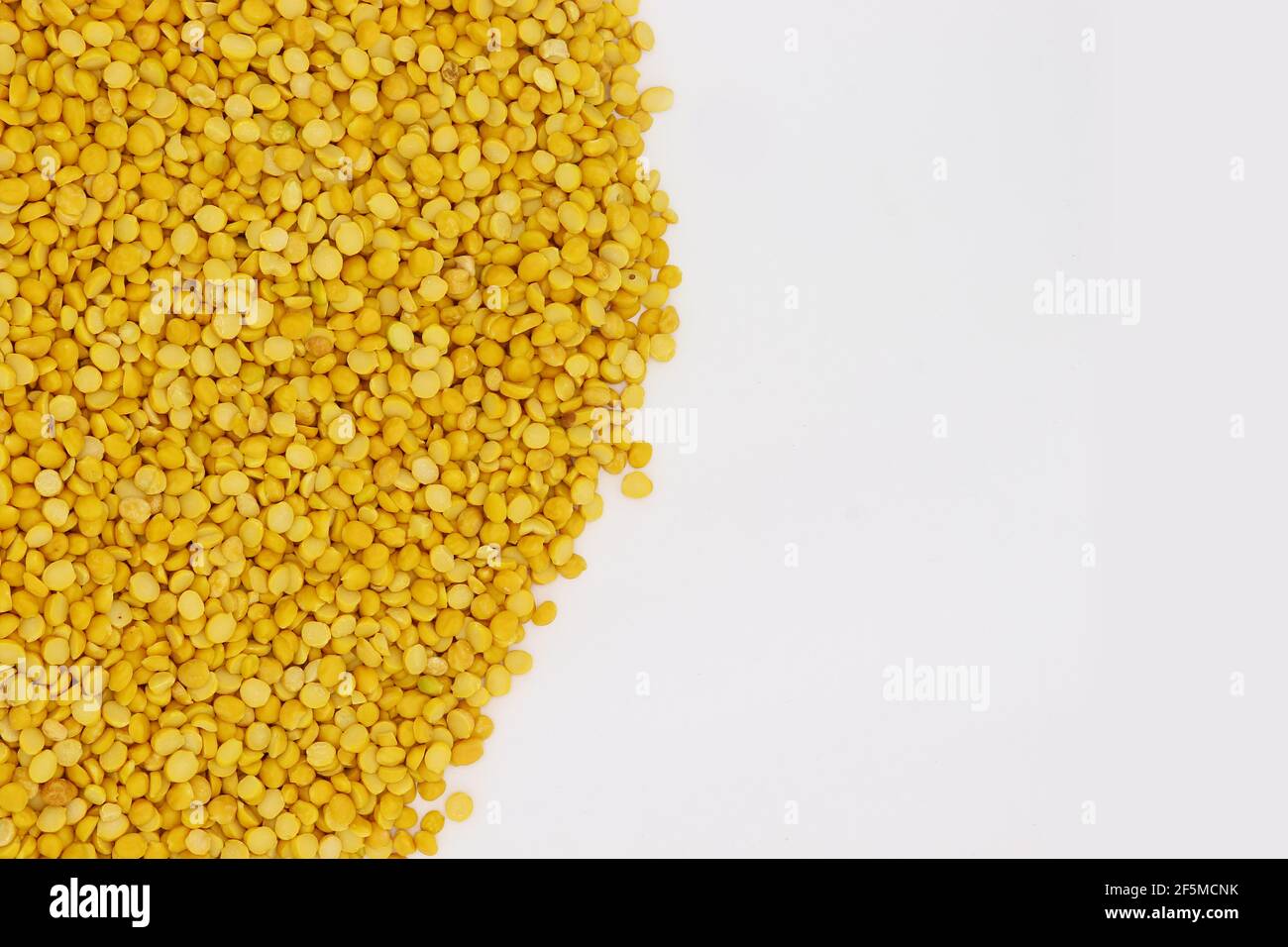 Daal Chana, Heap of yellow split chickpeas isolated on white background ...