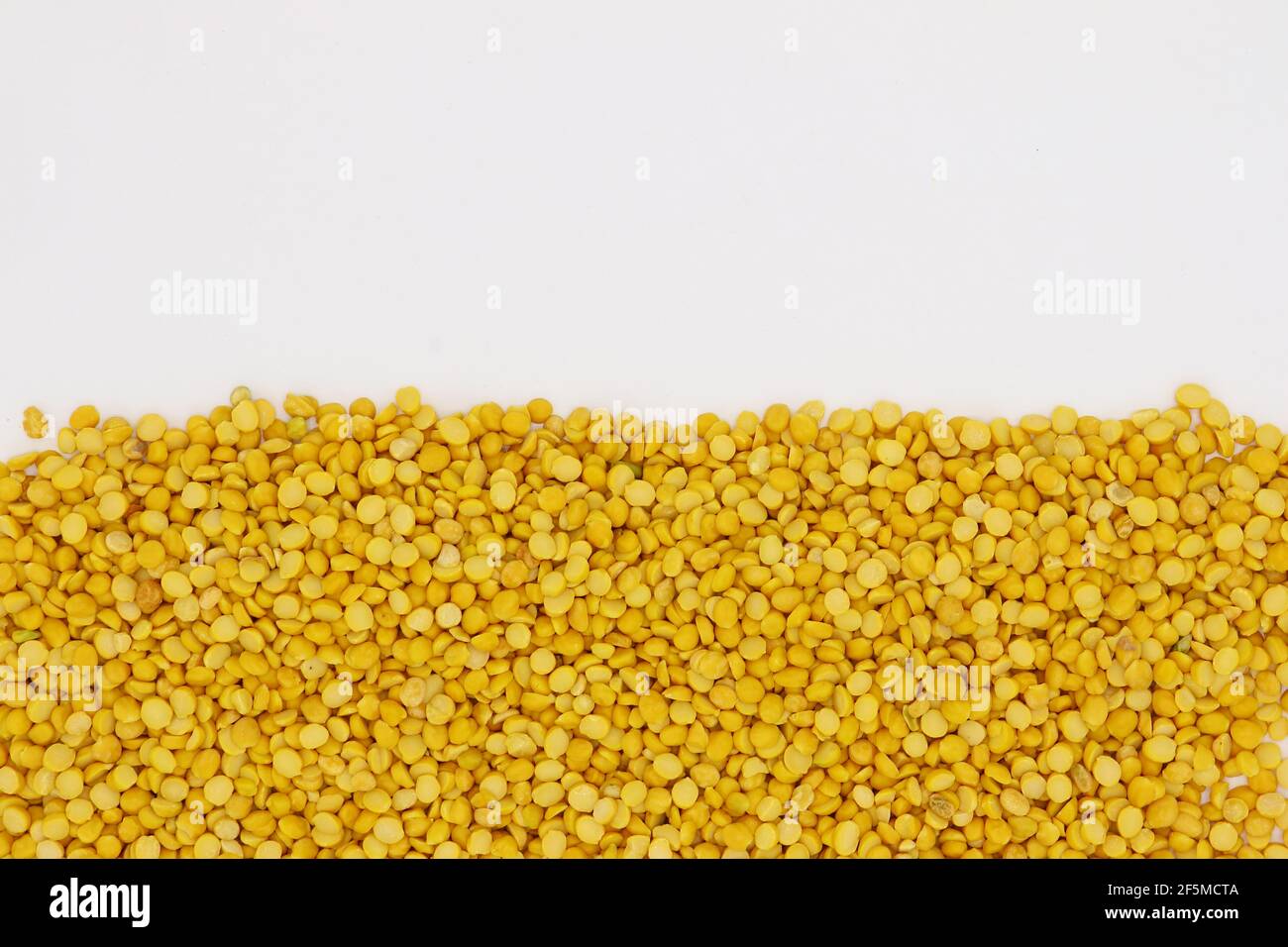 Daal Chana, Heap of yellow split chickpeas isolated on white background ...
