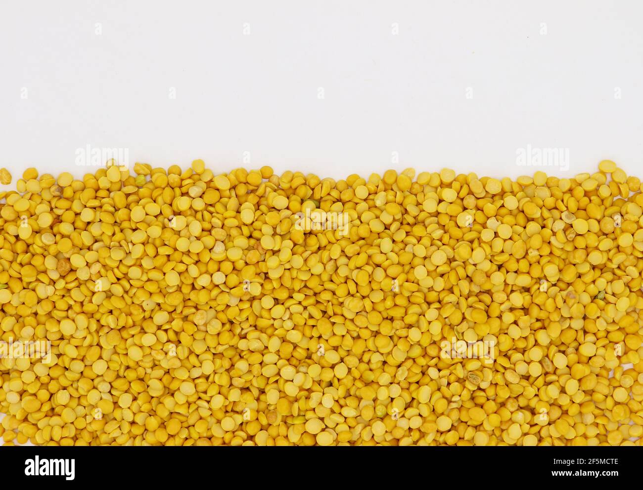 Daal Chana, Heap of yellow split chickpeas isolated on white background ...