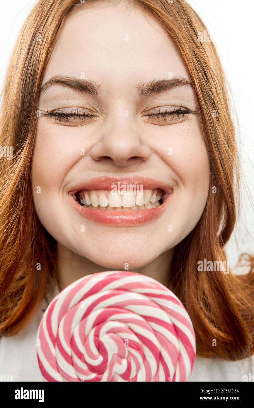 woman with open mouth holds lollipop near face Sweets joy Stock Photo ...