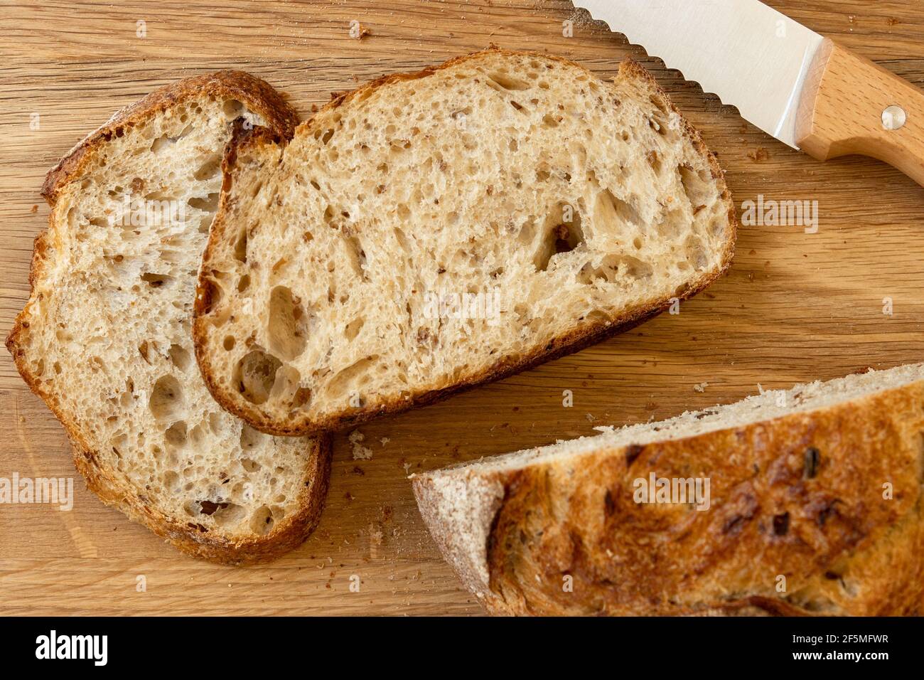 Cutting bread with traditional knife hi-res stock photography and ...