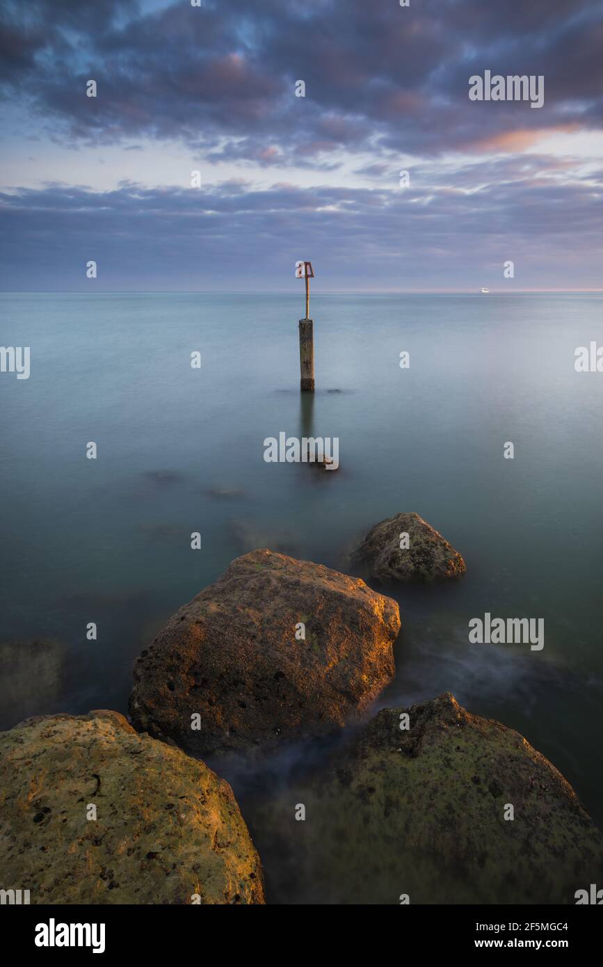 Southbourne Groyne Marker at sunset Stock Photo - Alamy