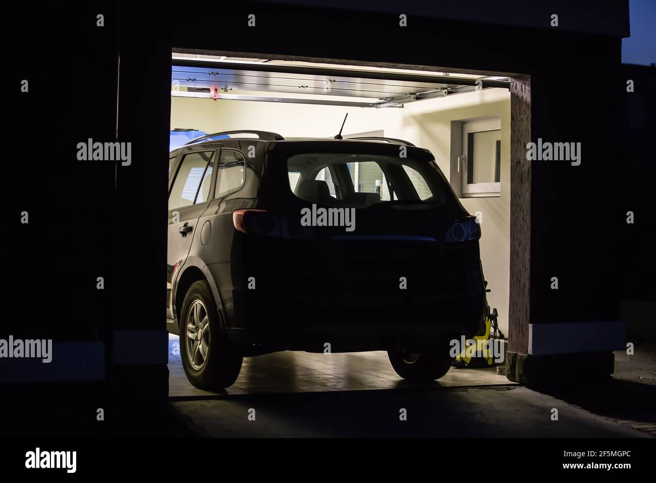 Empty garage illuminated by lamp hi-res stock photography and images ...