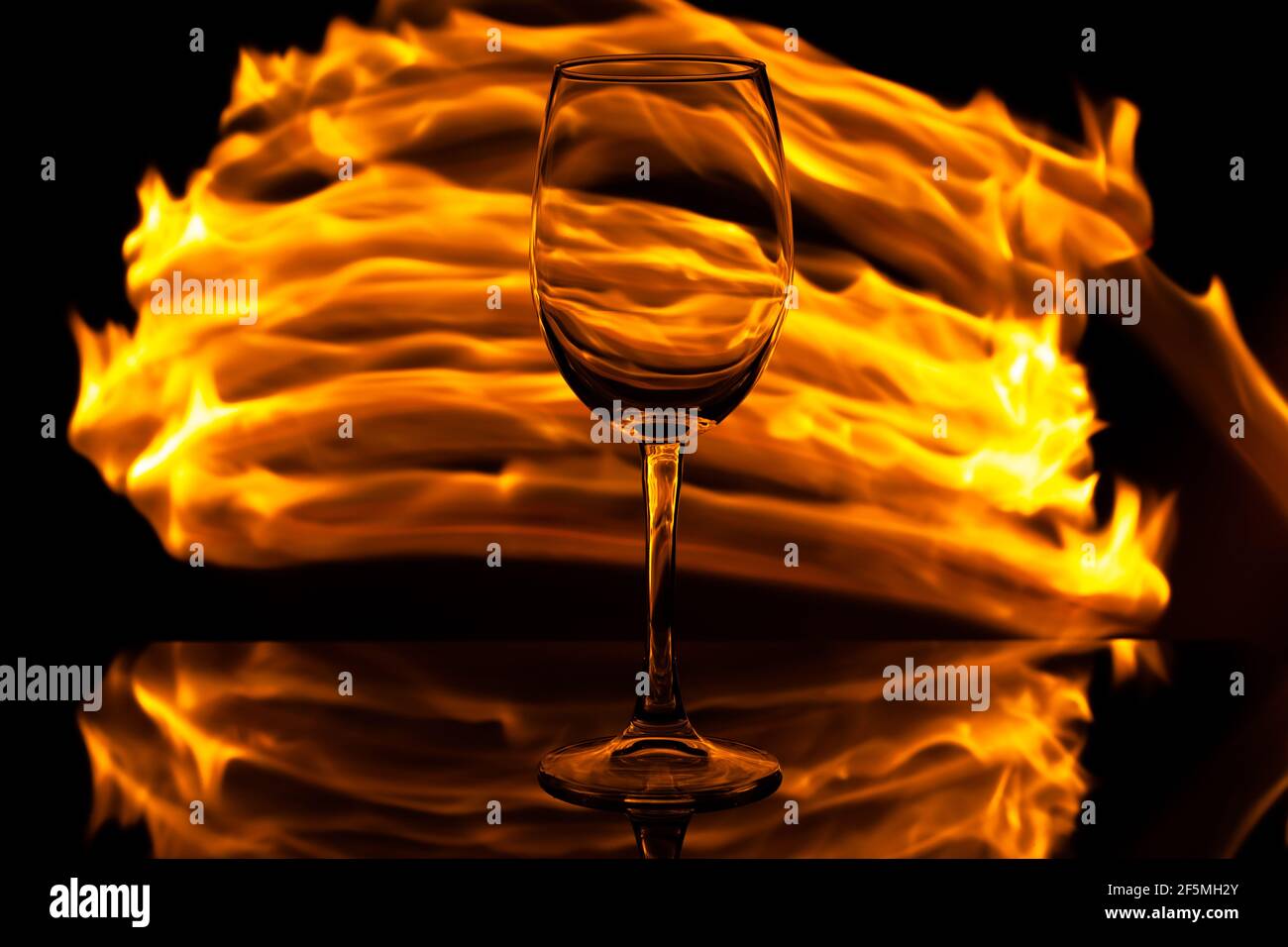 fire and wine glass, copy space, use as background Stock Photo - Alamy