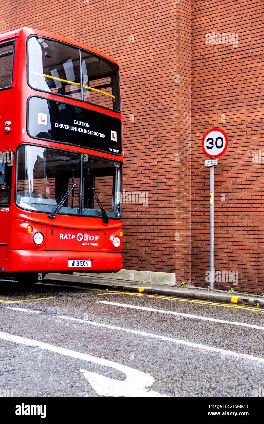 London UK, March 26 2021, Red Double Decker Bus Parked Next To A 30 mph ...