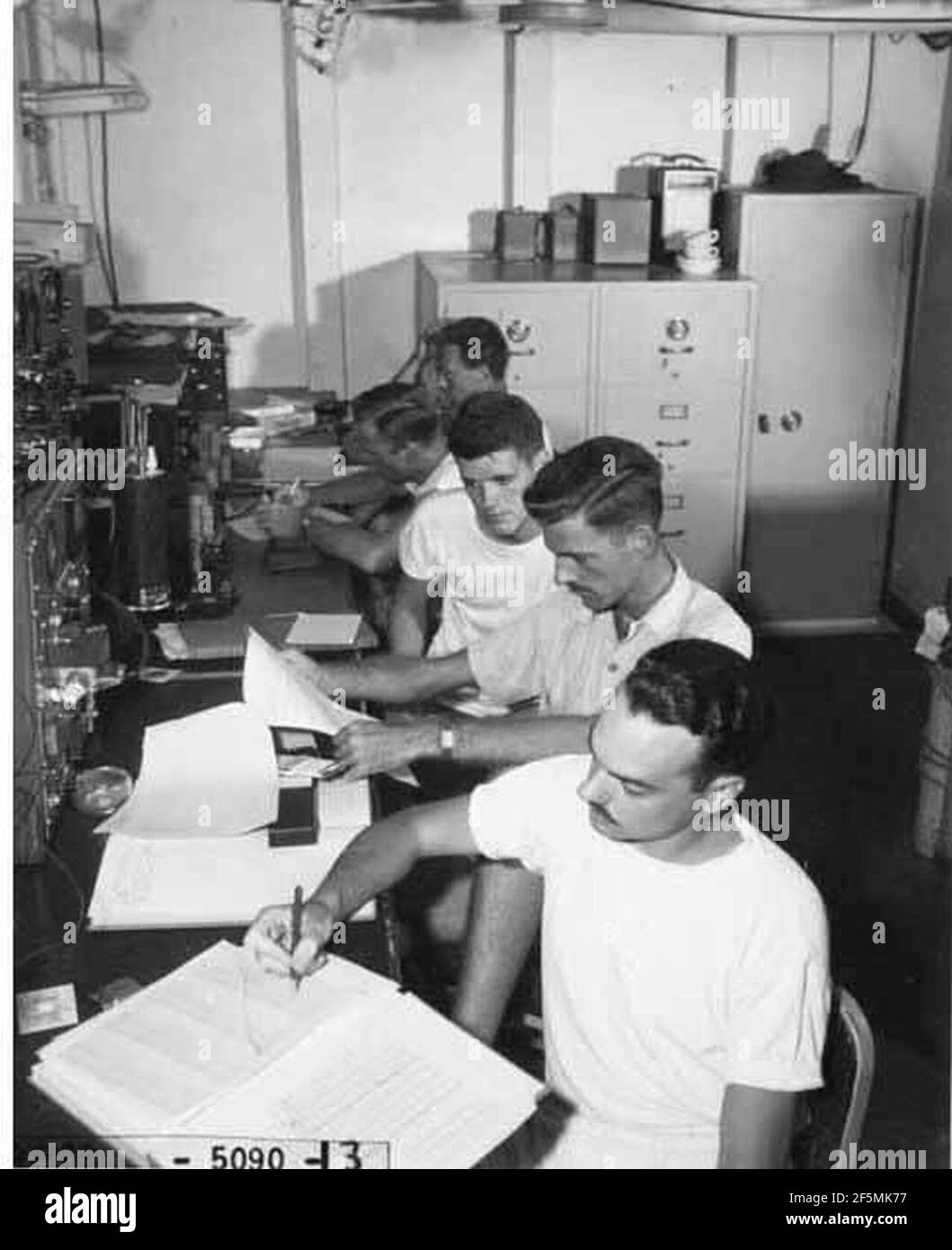 Radiochemists in the counter room on the USS CHILTON making Alpha and ...