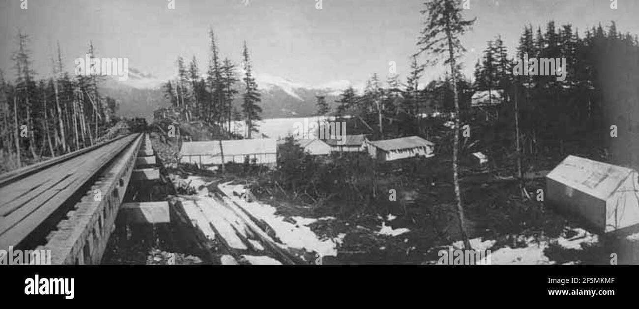 Railroad construction work camp next to tracks, probably in the ...