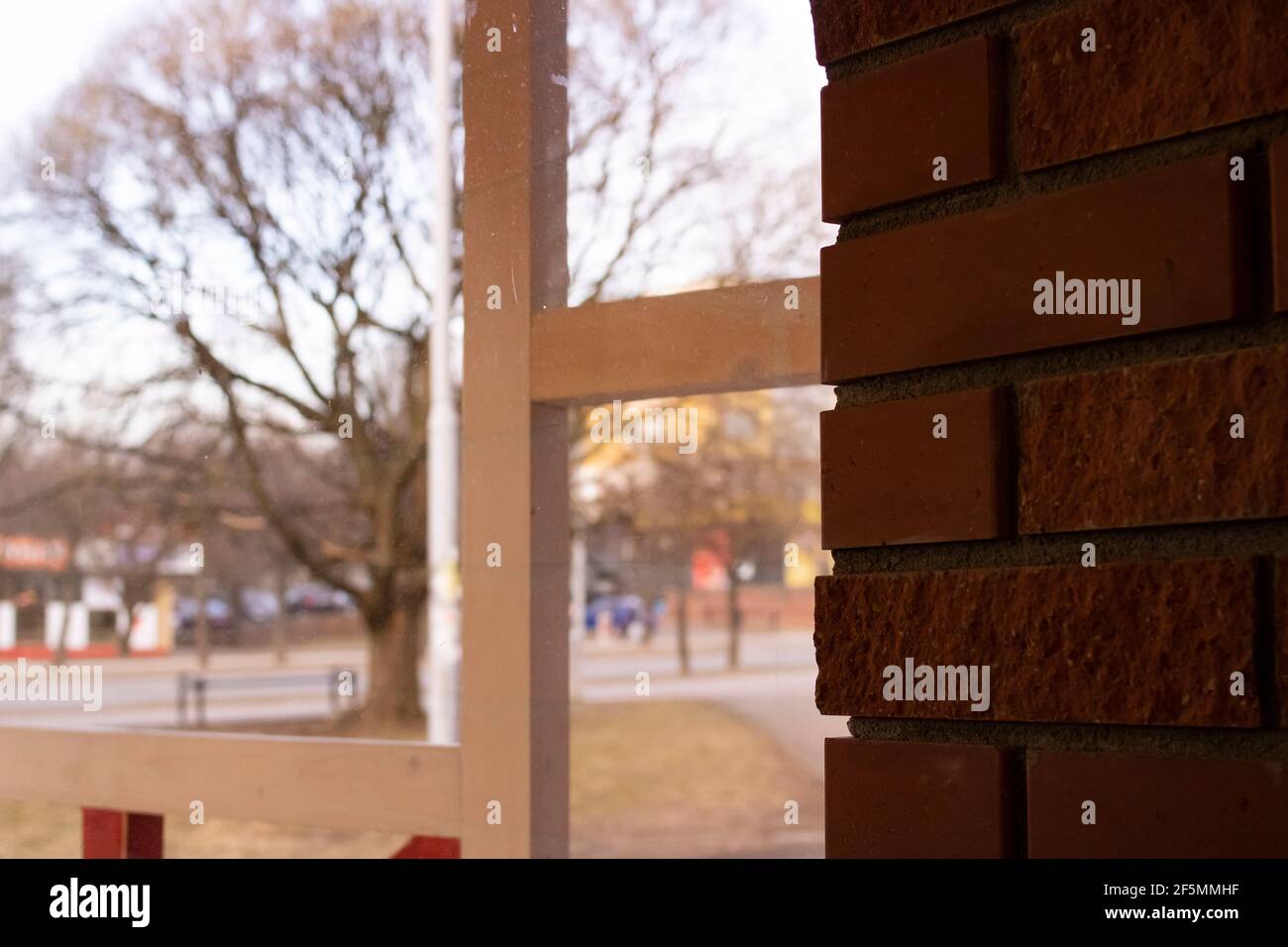 Brick wall and window overlooking the road close up Stock Photo - Alamy