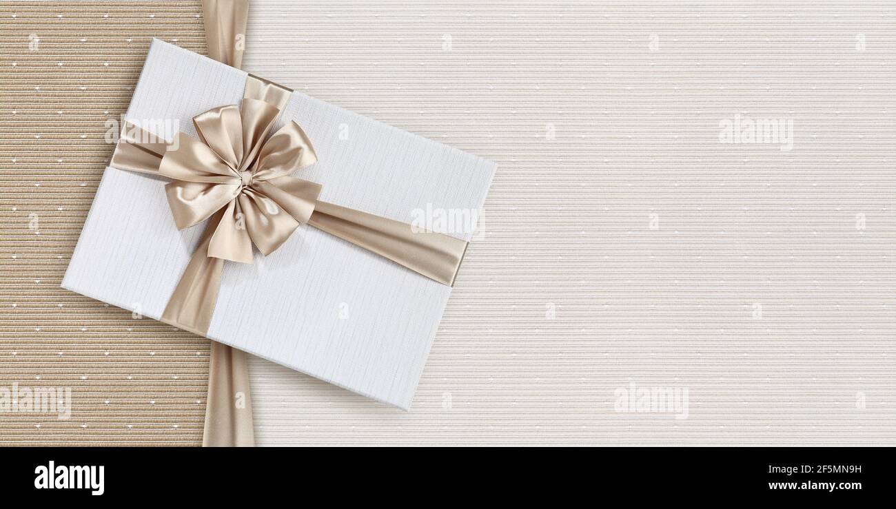 Gift card, gift box with beige ribbon bow isolated on elegant pearly ...