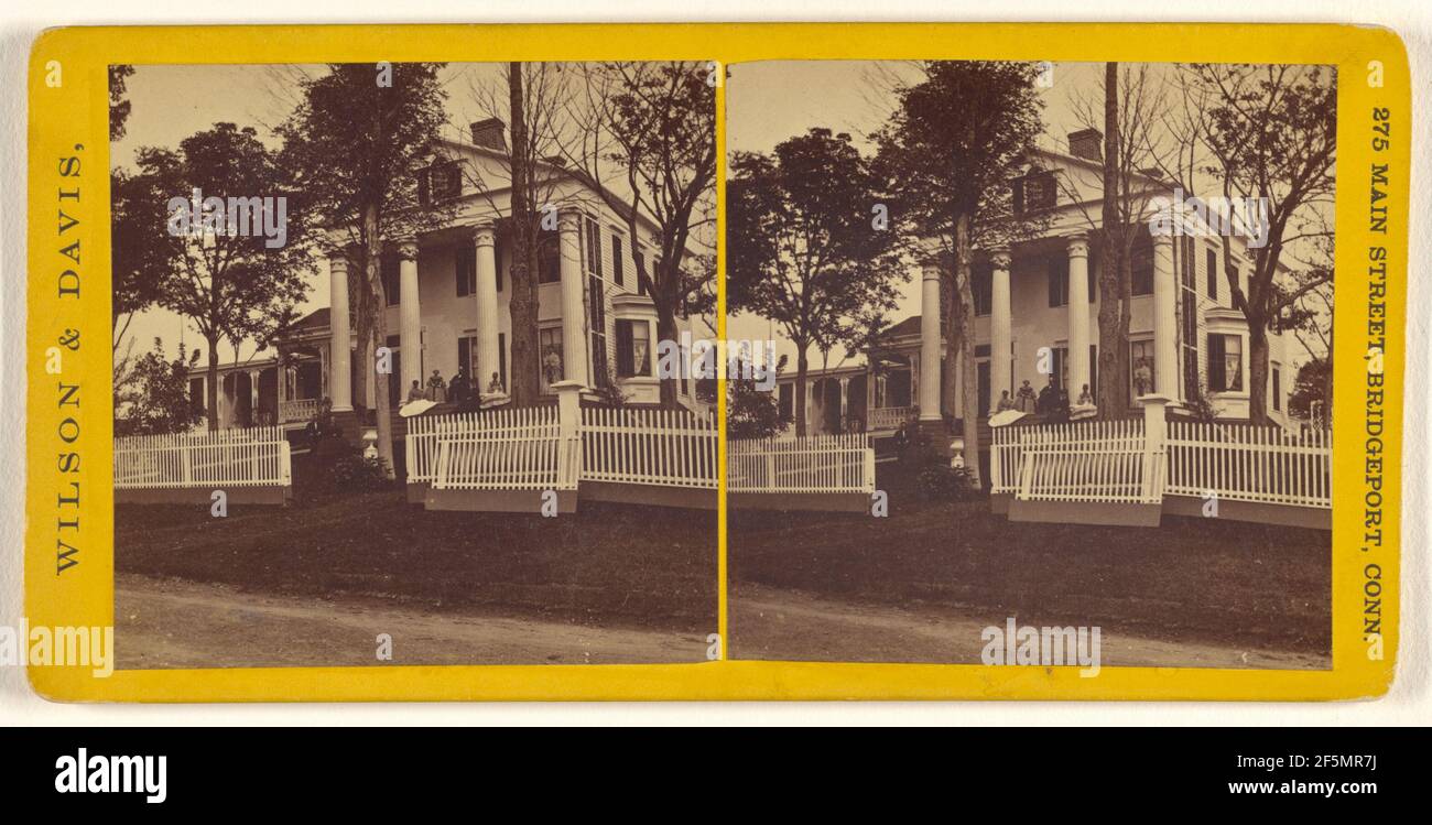 Long view of large house with columns, family on front porch. Wilson ...