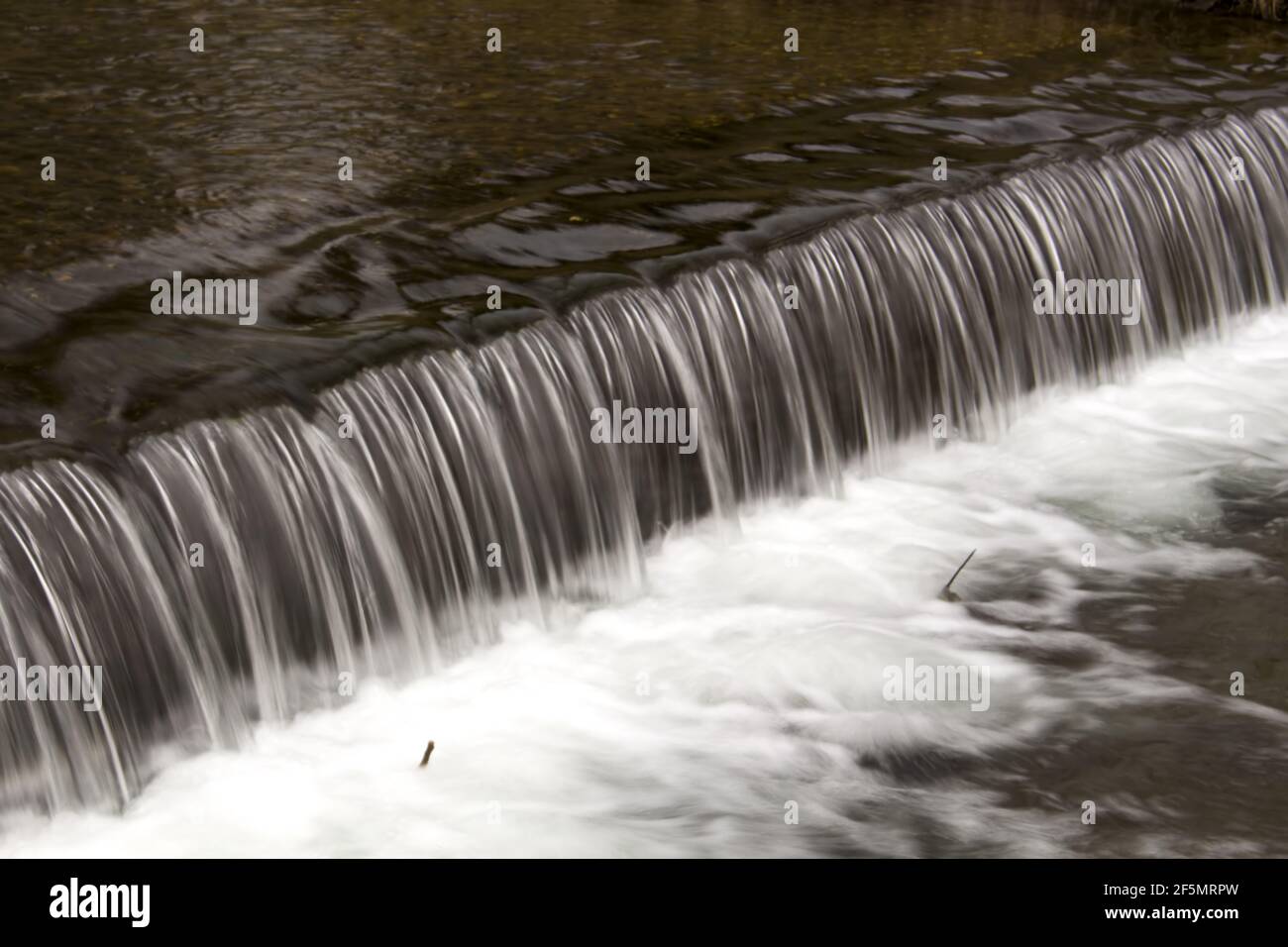 small weir on riverine Stock Photo - Alamy