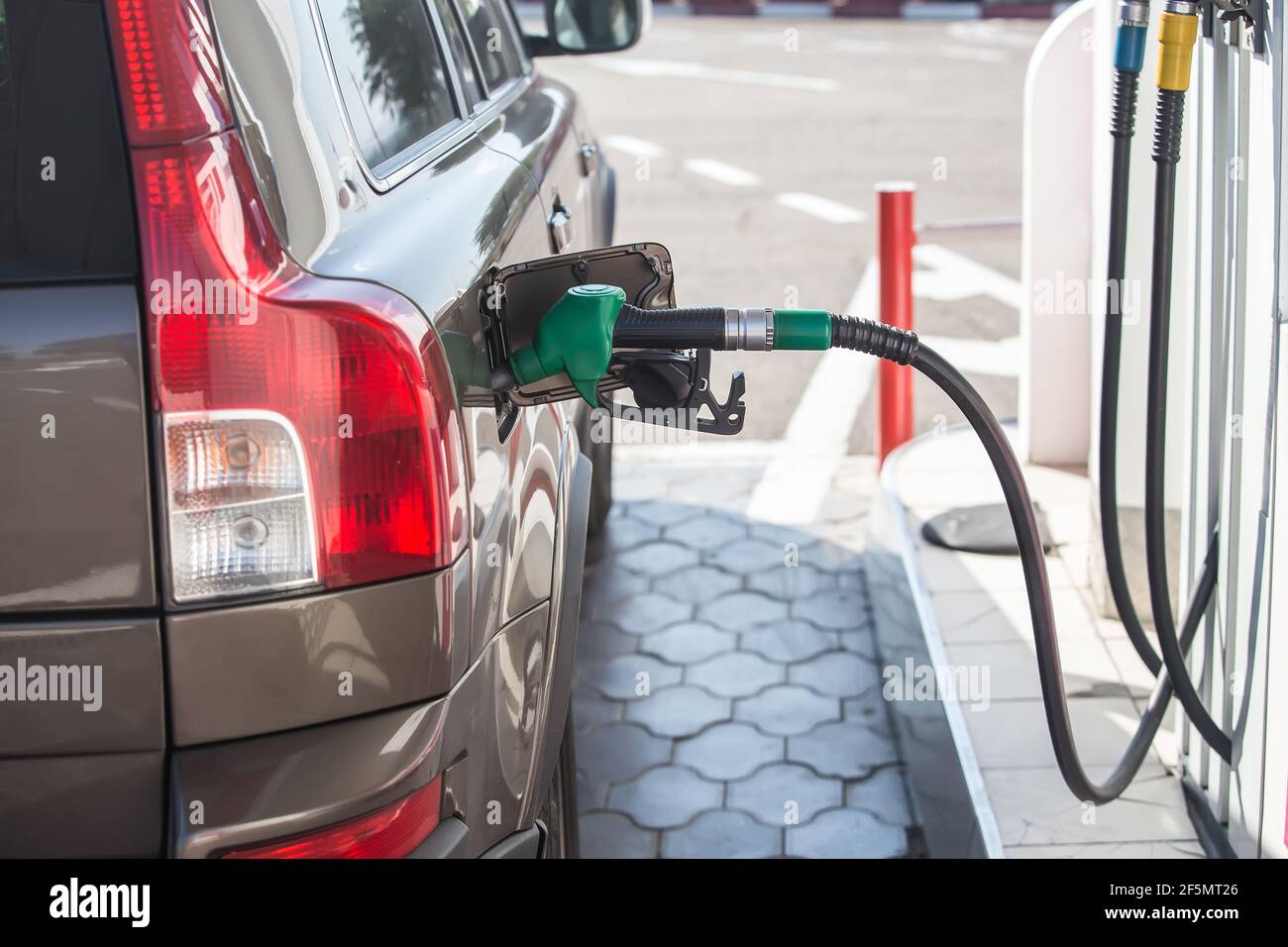 fuel gun in a gasoline tank car at a gas station Stock Photo - Alamy