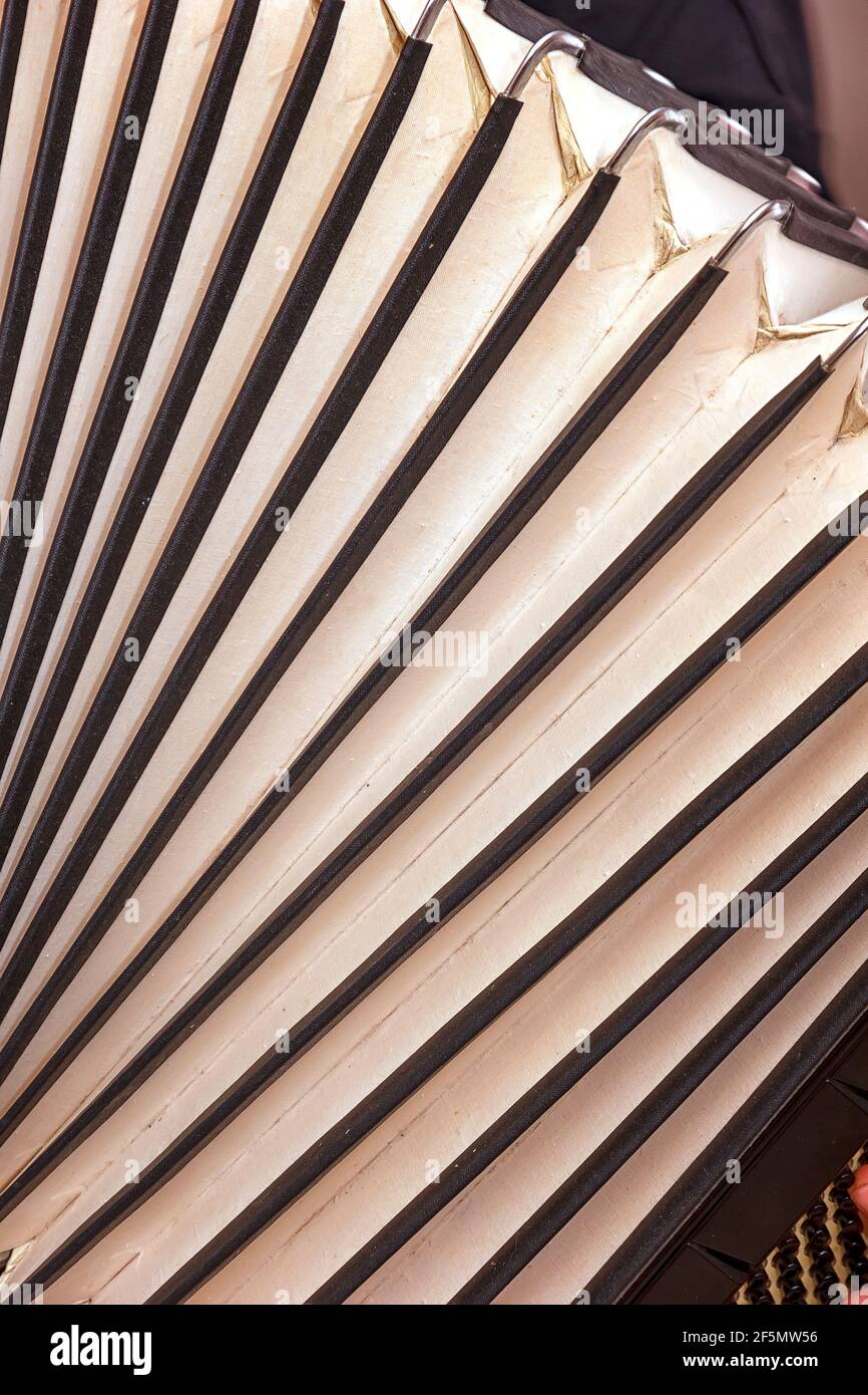 Red musical instrument bellows hi-res stock photography and images - Alamy