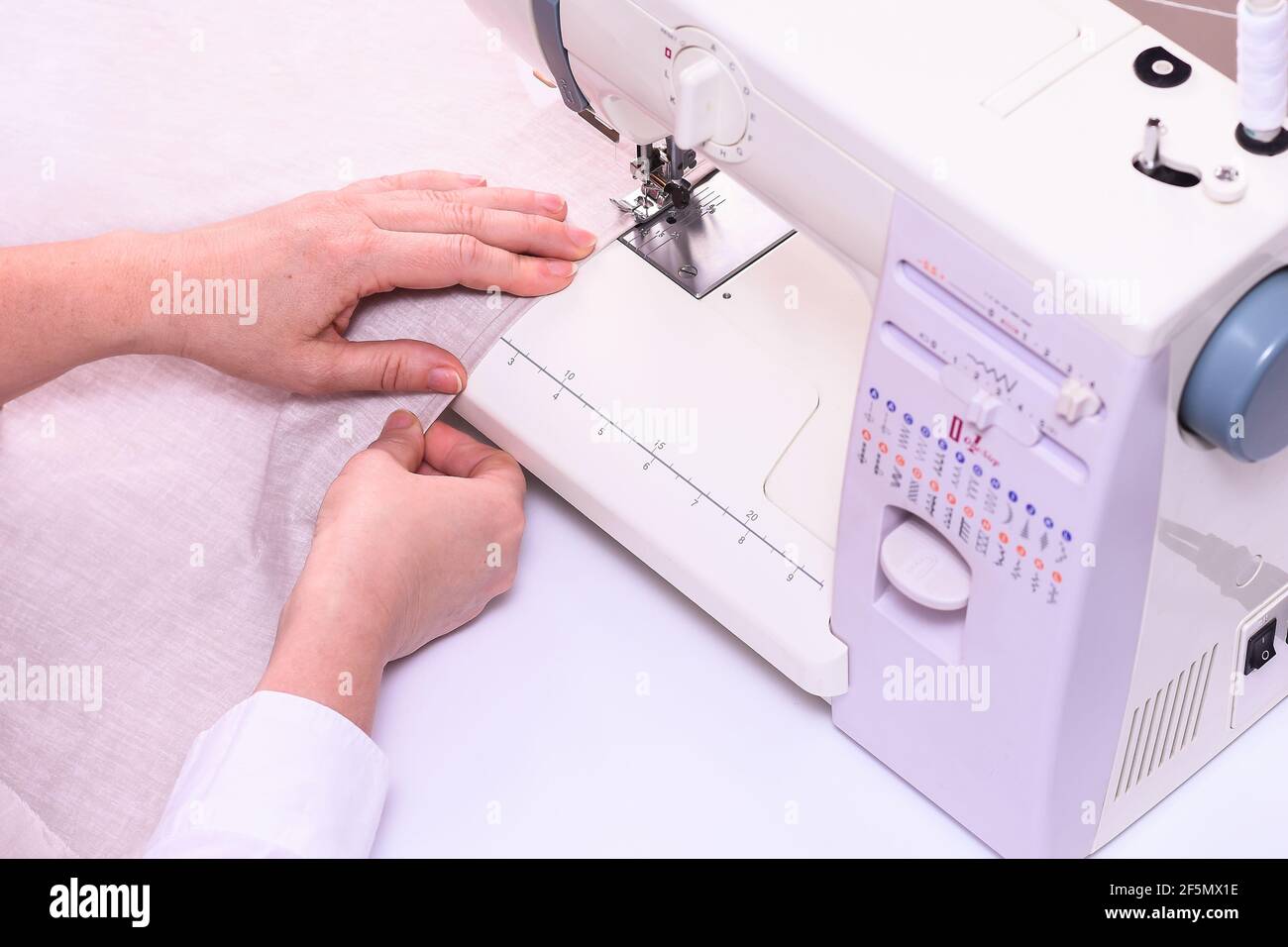 the process of sewing on a sewing machine Stock Photo - Alamy