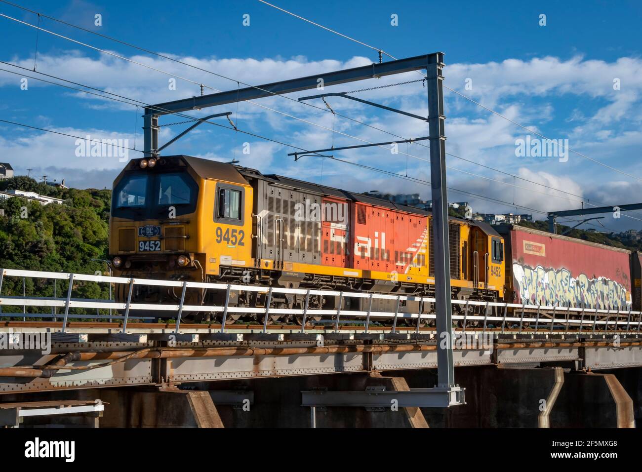 DL Class locomotive hauling a freight train across Paremata Bridge ...