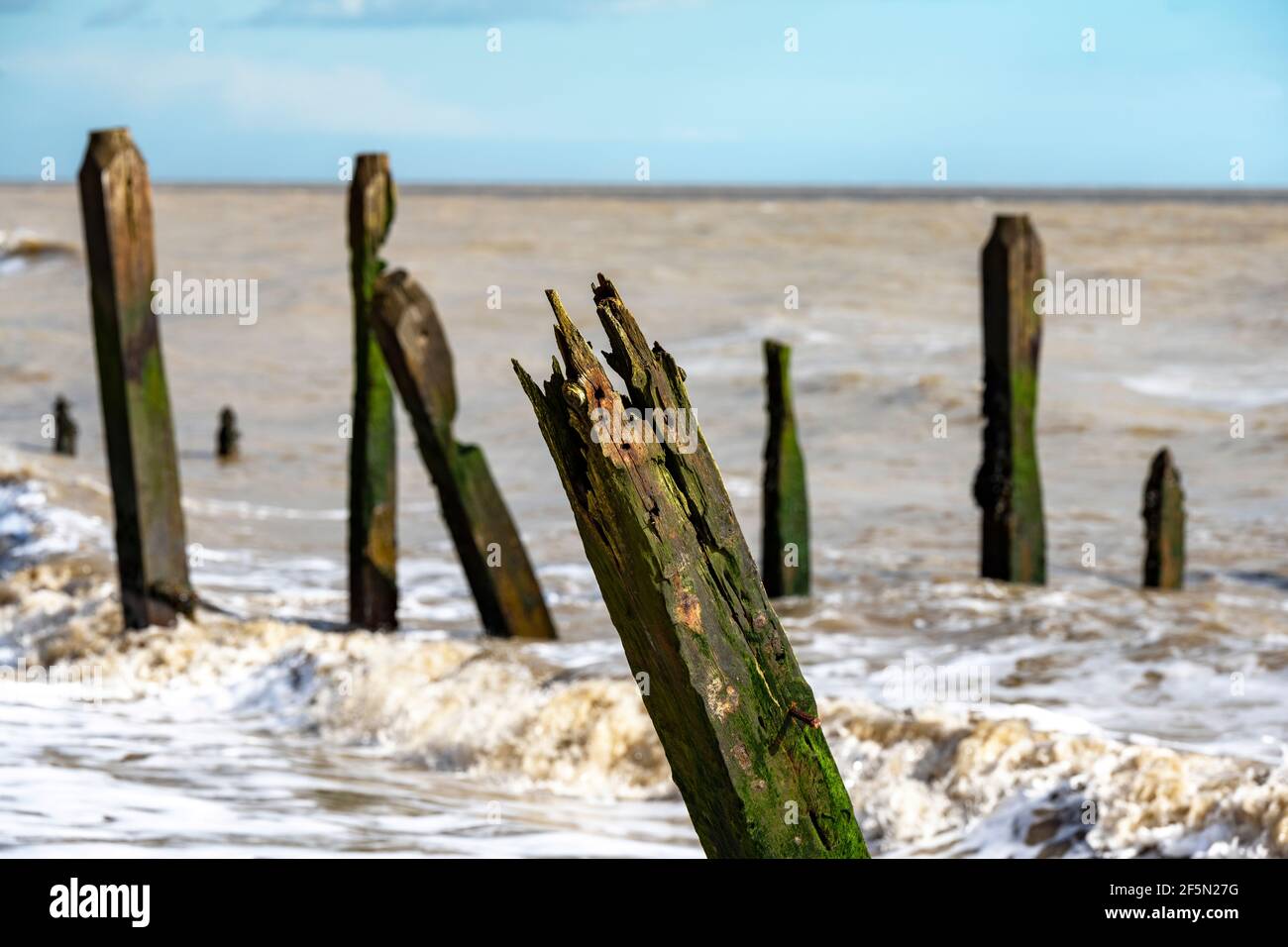 Damaged sea groynes hi-res stock photography and images - Alamy