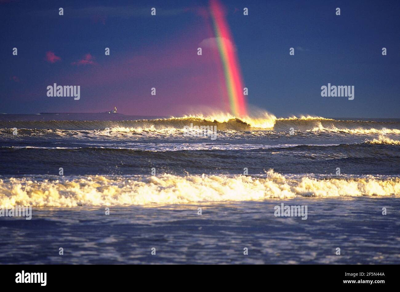 rainbow, over rough sea Stock Photo - Alamy
